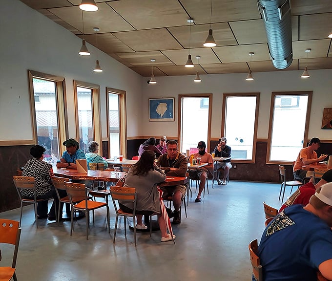 United nations of pizza lovers. At Miguel's, strangers become friends over slices, swapping tales of epic climbs and cheesy conquests.