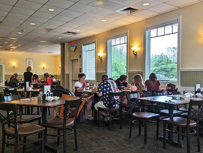 A slice of small-town America, served fresh daily. These happy diners aren't just eating &ndash; they're participating in a time-honored tradition of good food and even better company.