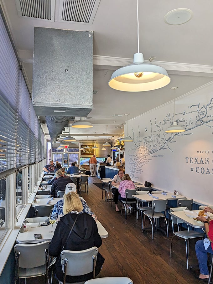 A map of deliciousness on the wall, and happy diners plotting their culinary course below.
