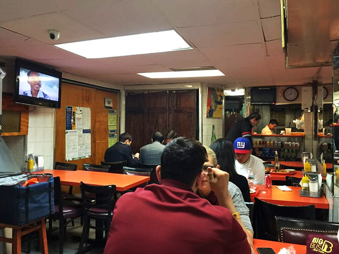 A slice of New York life, served with a side of Cuban flair. Here, strangers become amigos over shared tables and steaming plates.