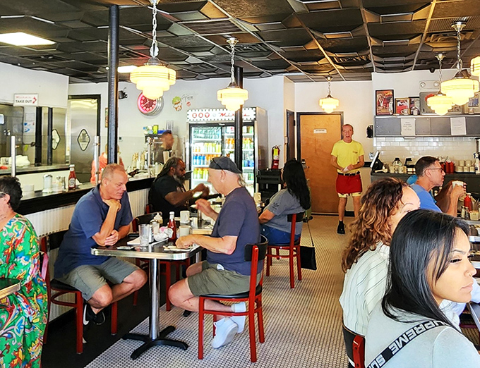 A slice of Americana, served fresh daily. The diverse crowd proves that good food is the universal language we all speak fluently.