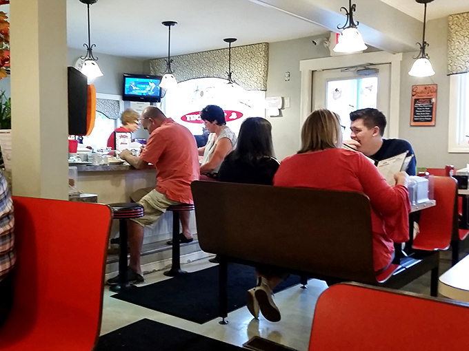 A gathering of the breakfast faithful. At Margie's counter, strangers become friends, united by the universal language of "yum."