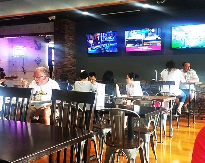 Diners dive into their dishes with gusto. It's like watching a delicious silent movie, where the food is the star of the show.