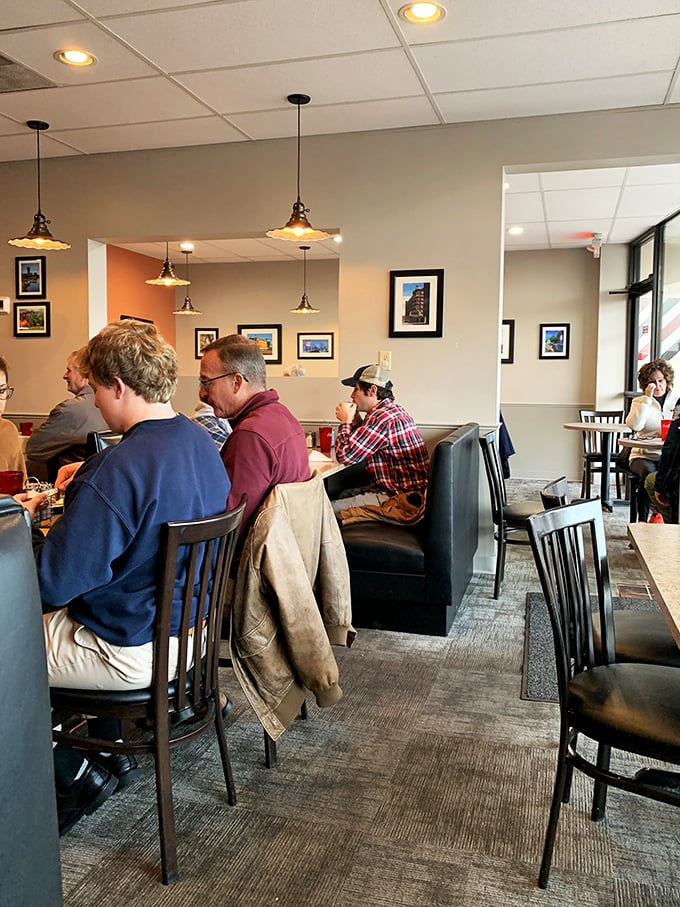 A slice of Americana, served with a side of friendly chatter. These diners aren't just eating breakfast; they're living Norman Rockwell's dream.