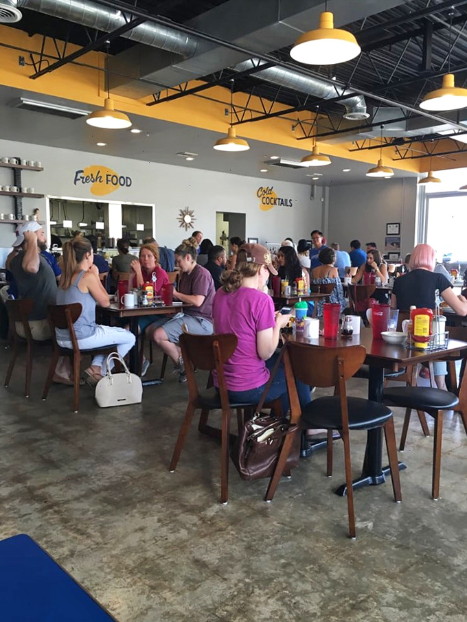 A bustling breakfast haven where strangers become friends over shared syrup and bacon-scented air. It's community served sunny side up!