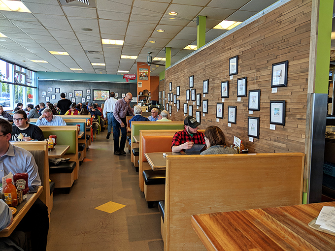 A bustling scene of happy diners, proving that good food brings people together faster than you can say "pass the syrup."