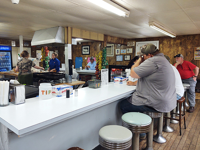Pull up a stool and join the burger brotherhood. At Dovie's, strangers are just friends you haven't shared fries with yet.