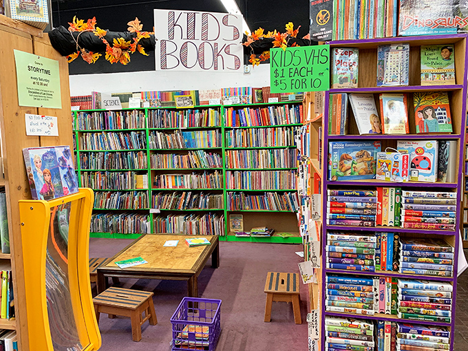 A rainbow of reading awaits! This kids' corner is where young imaginations take flight and parents secretly wish they could shrink to join in.