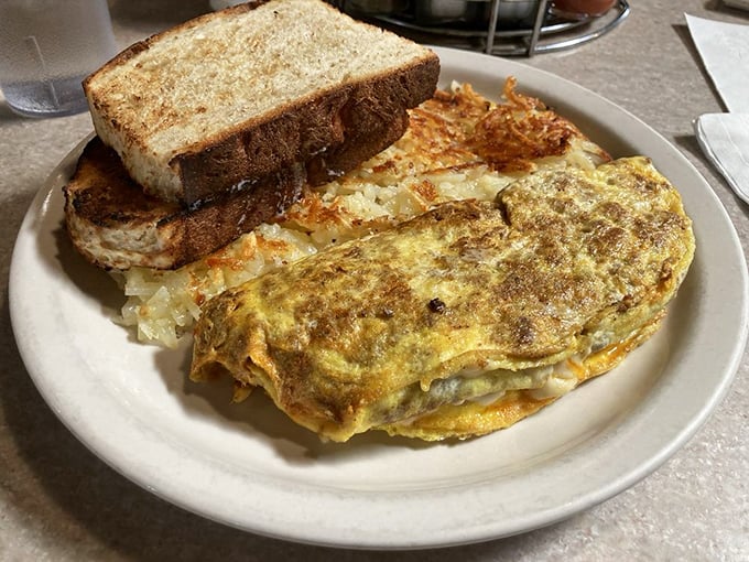 Eggs-cellent choice! This hearty omelet is packed with more fillings than your grandma's photo album. A true breakfast of champions.
