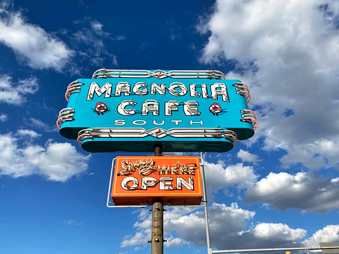 Lights, camera, breakfast! Magnolia Cafe's iconic sign stands out against the Austin sky like a beacon of hope for the hungry and hungover alike.