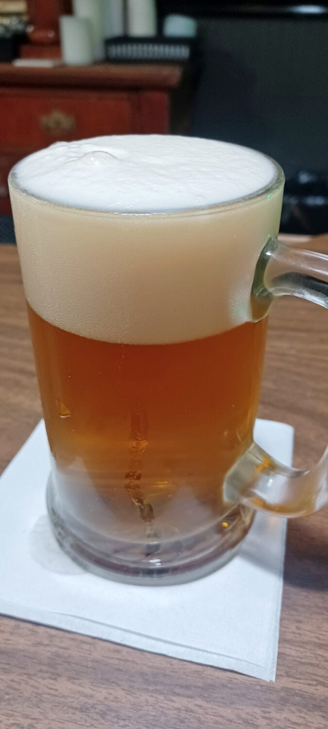 Foam sweet foam! This frothy mug of beer is the perfect dance partner for Andy's pizza &ndash; they should really be on "Dancing with the Stars."