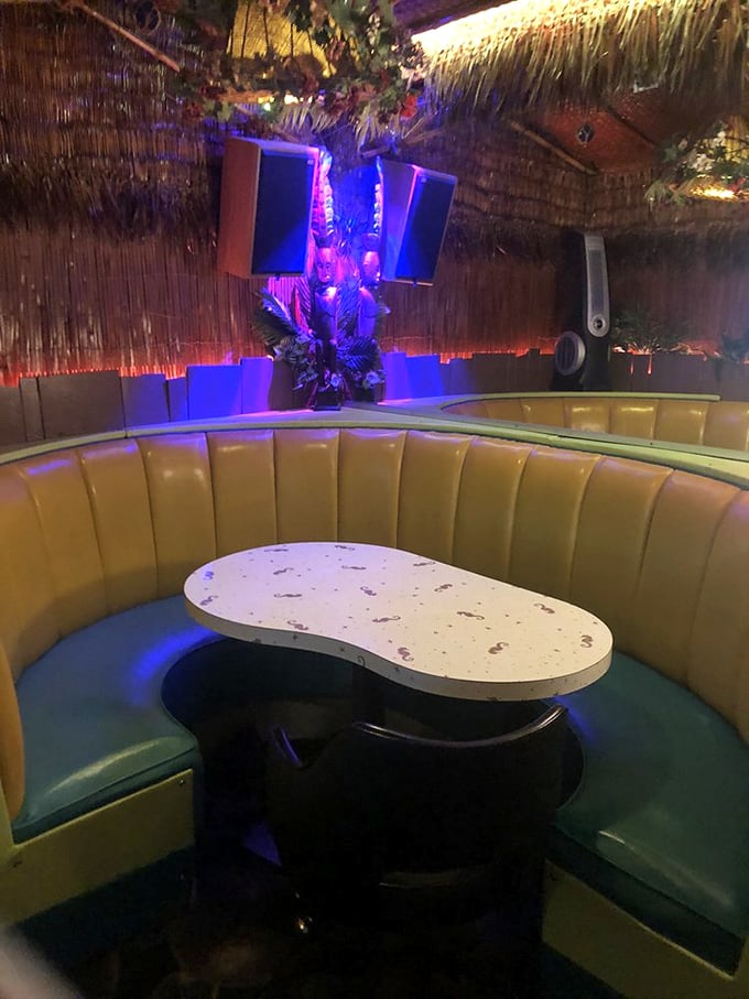 Cozy up in this golden booth &ndash; it's like being inside King Triton's personal man cave, but with better drinks and fewer tridents.
