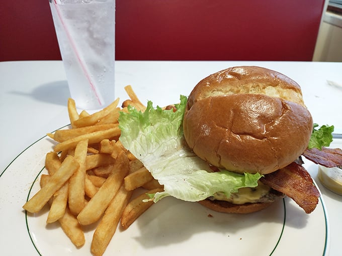 This isn't just a burger&mdash;it's architecture. A perfectly constructed tower of beef, bun, and fixings with fries standing guard.