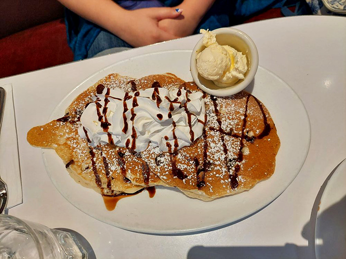 Pancake paradise! This stack is so fluffy, it might float away if not for that dollop of butter acting as a delicious paperweight.