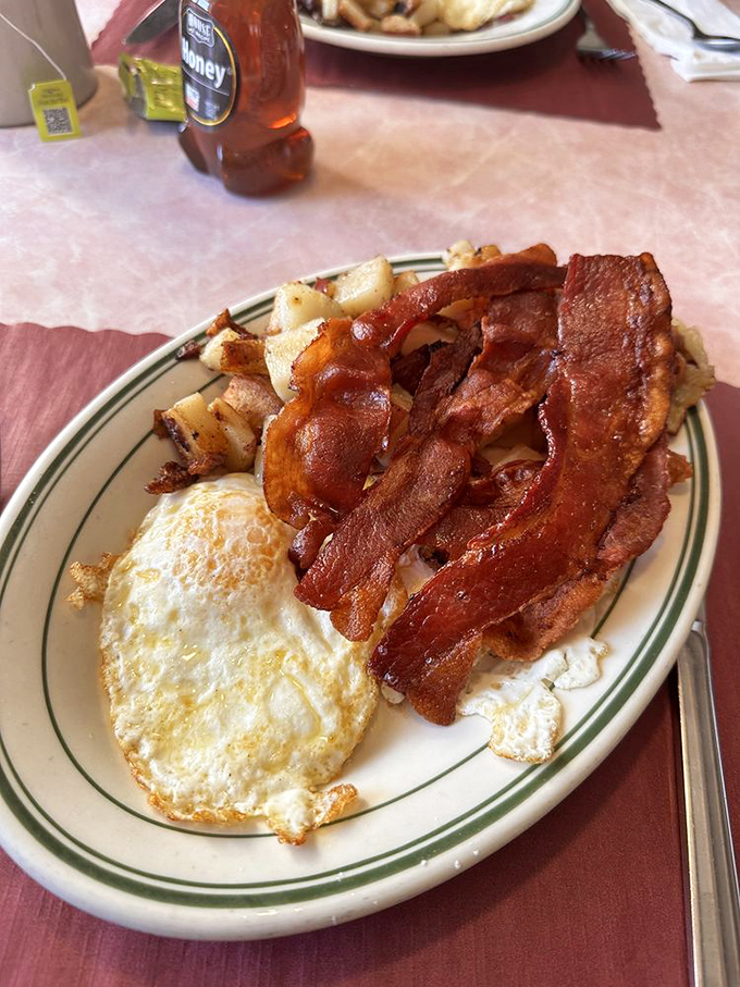 Bacon so crispy, it could wake the dead. Paired with sunny-side-up eggs, it's the breakfast equivalent of a standing ovation.