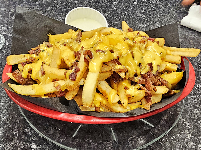 Fries that could start a turf war with Belgium! Crispy, cheesy, and bacon-y – it's the holy trinity of potato perfection.
