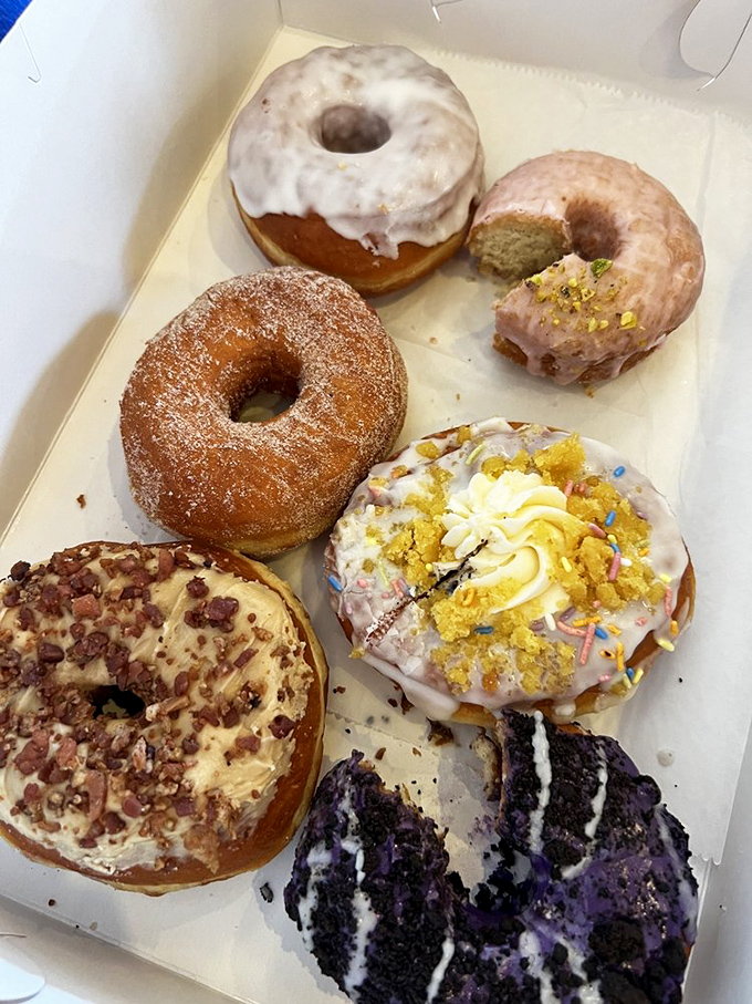 The assortment that launched a thousand diets—and made breaking them worthwhile. That purple-glazed wonder looks suspiciously like happiness.