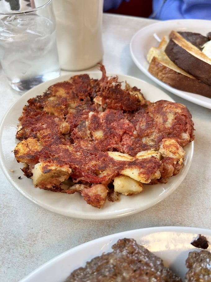 Home fries so crispy, they could wake you up faster than your alarm clock. Paired with eggs sunny-side up, it's a plate of pure morning joy!