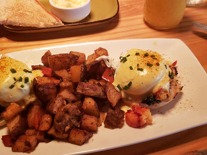 Lobster Benedict with perfectly poached eggs &ndash; breakfast's way of saying, "You deserve nice things" without checking your bank account first.