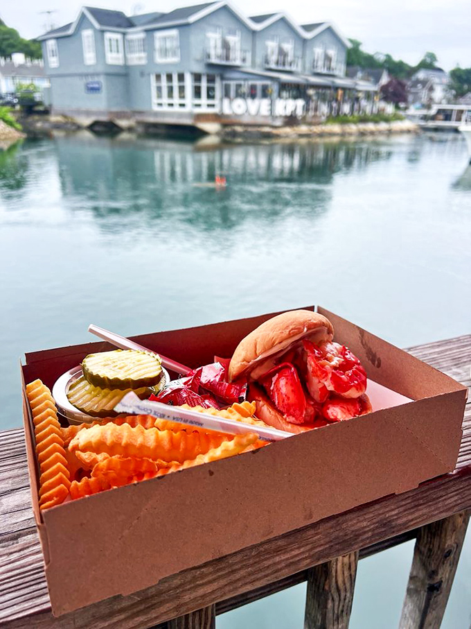 The perfect trio: a lobster roll, crispy fries, and a view to die for. It's like a postcard you can eat!