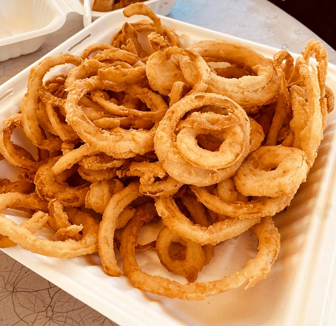 Onion rings so perfectly crisp and golden, they could be Olympic medals for flavor. These hoops of happiness are a slam dunk for your taste buds.