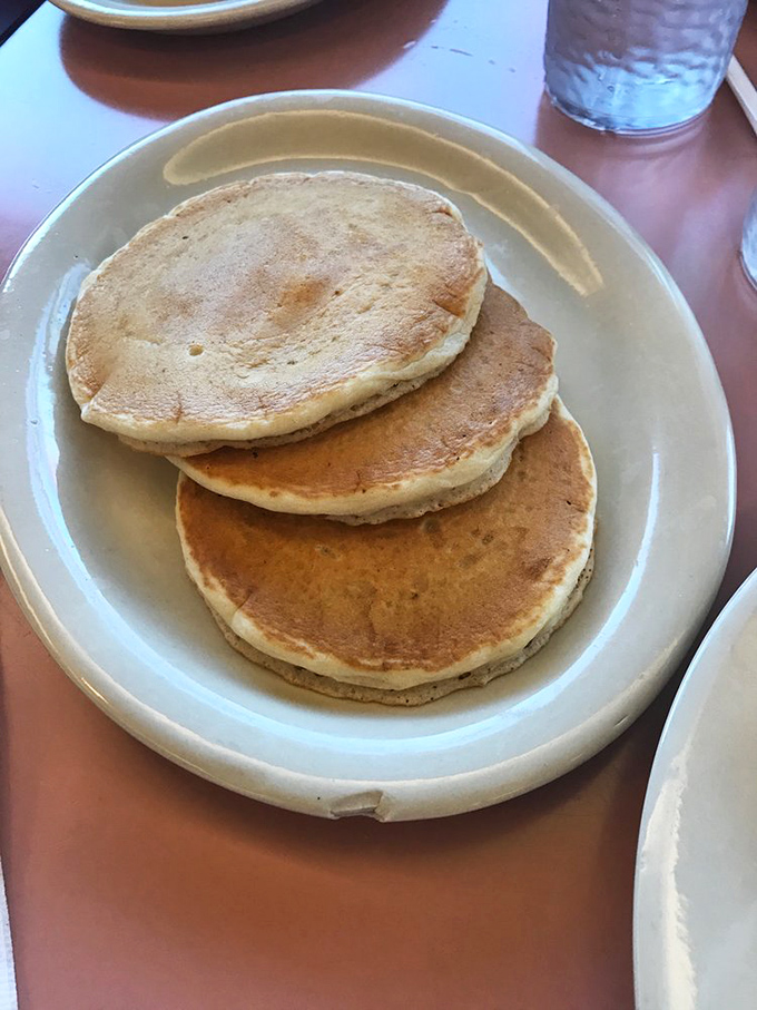 Stack 'em high! These pancakes are fluffier than a cloud factory and more comforting than your favorite blanket.
