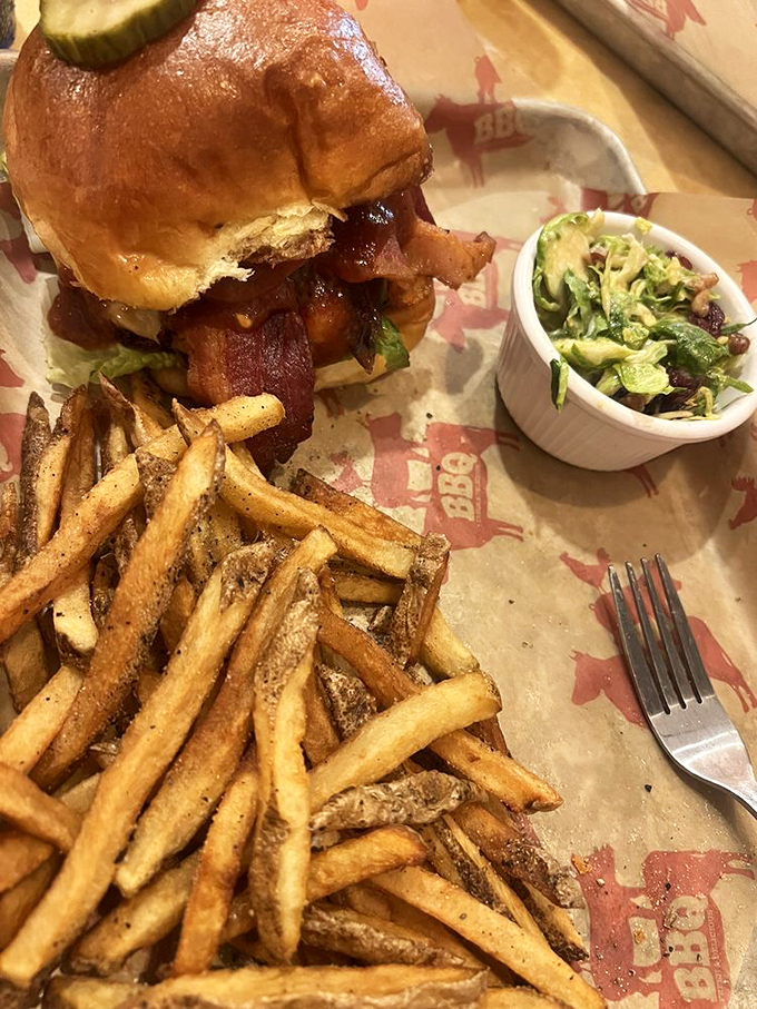 A burger that requires both hands, a stack of napkins, and possibly signing a waiver. Worth every delicious, messy bite.