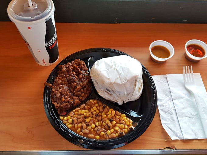 The pulled pork sandwich: where bread becomes a mere vehicle for delivering smoky, saucy goodness straight to your taste buds.