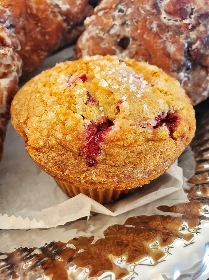 A raspberry muffin that's bursting with flavor &ndash; and probably your jeans. But hey, life's too short for regrets and tight pants.