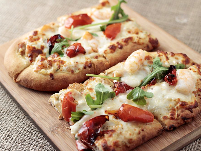 Who said you can't teach an old flatbread new tricks? This seafood-topped wonder is pizza's sophisticated coastal cousin.