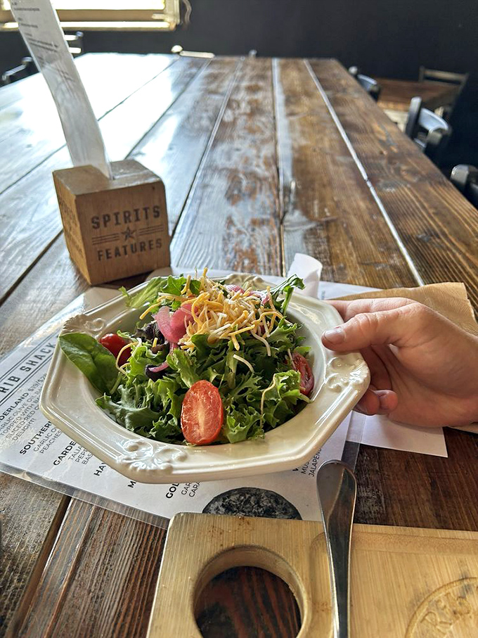 Even the salad looks excited to be here! A fresh, crisp counterpoint to all that smoky goodness.