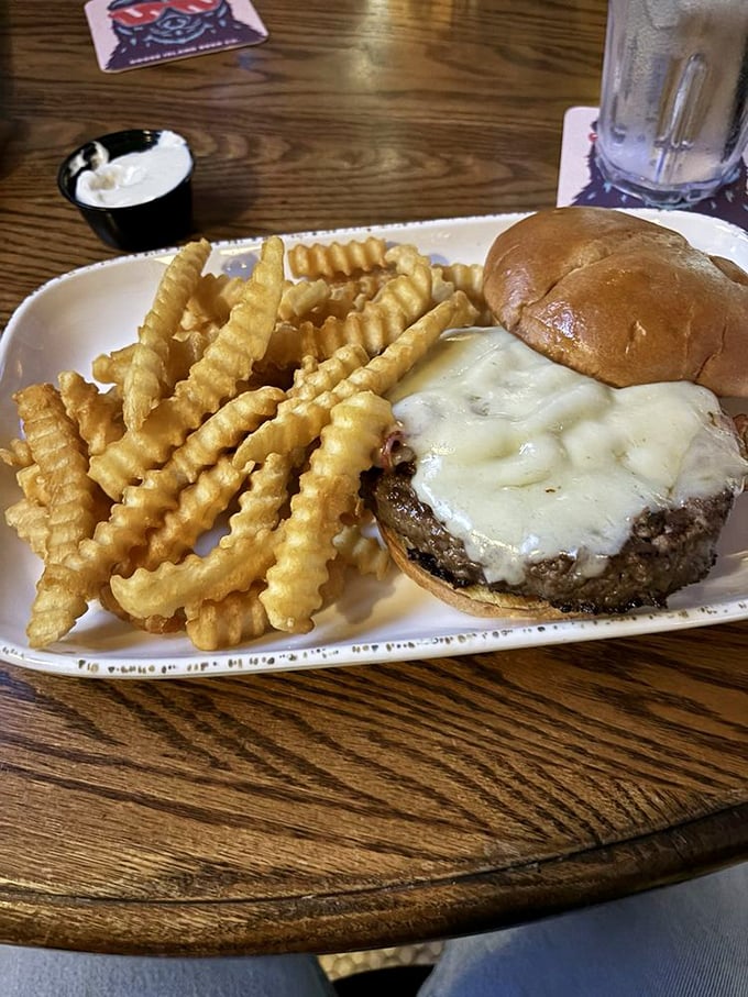 Bacon and Swiss, a match made in burger heaven. This patty's so juicy, you might need to sign a waiver before diving in!