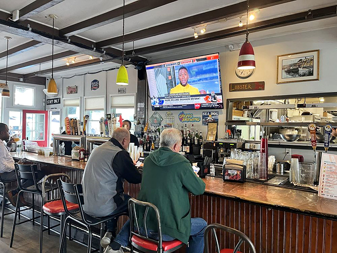 The bar: where sea tales get taller and the beer flows like the tide. A front-row seat to Maine's liquid hospitality.