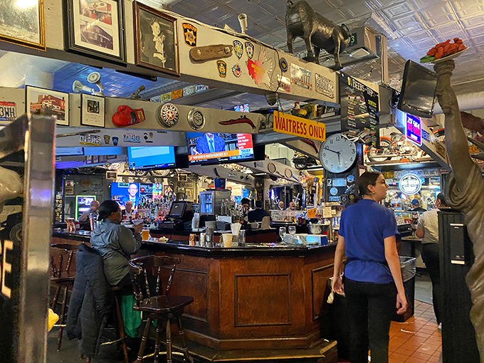 The bar area feels like a museum of Americana, where license plates and memorabilia create the perfect backdrop for wing consumption.