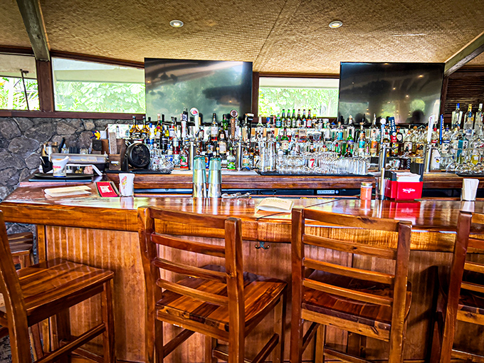 Mixology magic happens here! This bar isn't just stocked; it's an arsenal of tropical delights waiting to be unleashed. Cocktail hour, anyone?