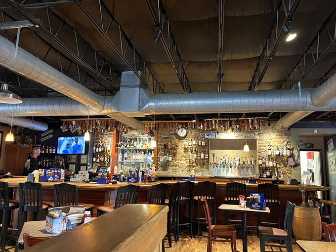 The bar area balances rustic charm with serious drinking intentions. Where barbecue stories get better with each local craft beer.