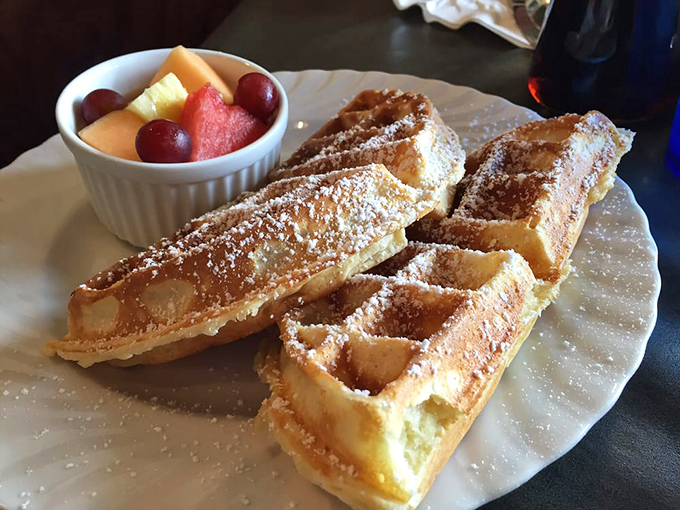 Waffles so golden and crisp, they deserve their own museum exhibit. The fruit cup? That's just nature's confetti.