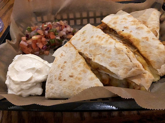 This quesadilla is folded like origami, but instead of paper cranes, you get a pocket full of Tex-Mex sunshine.