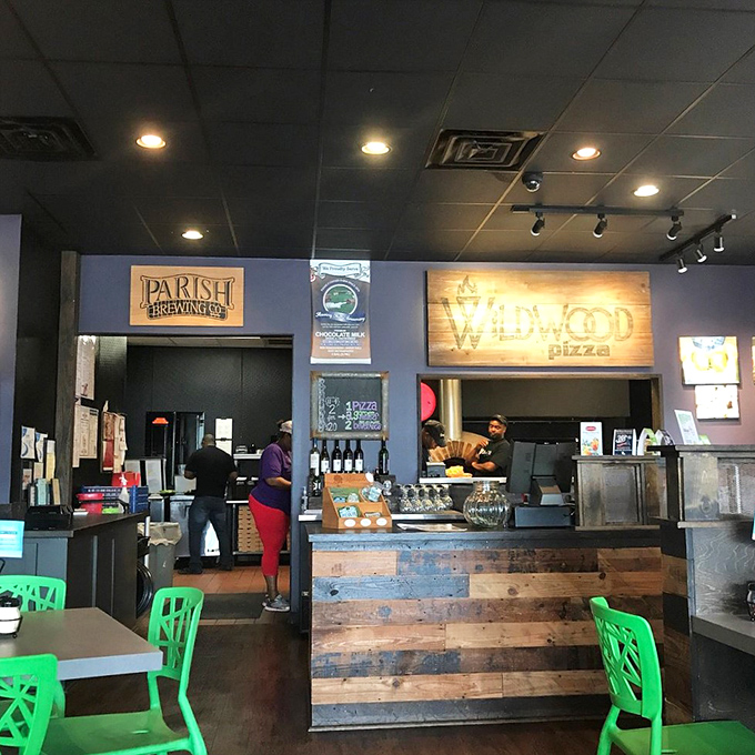 The counter: Where pizza dreams become reality. It's like watching your favorite movie, but instead of popcorn, you get to eat the star of the show.