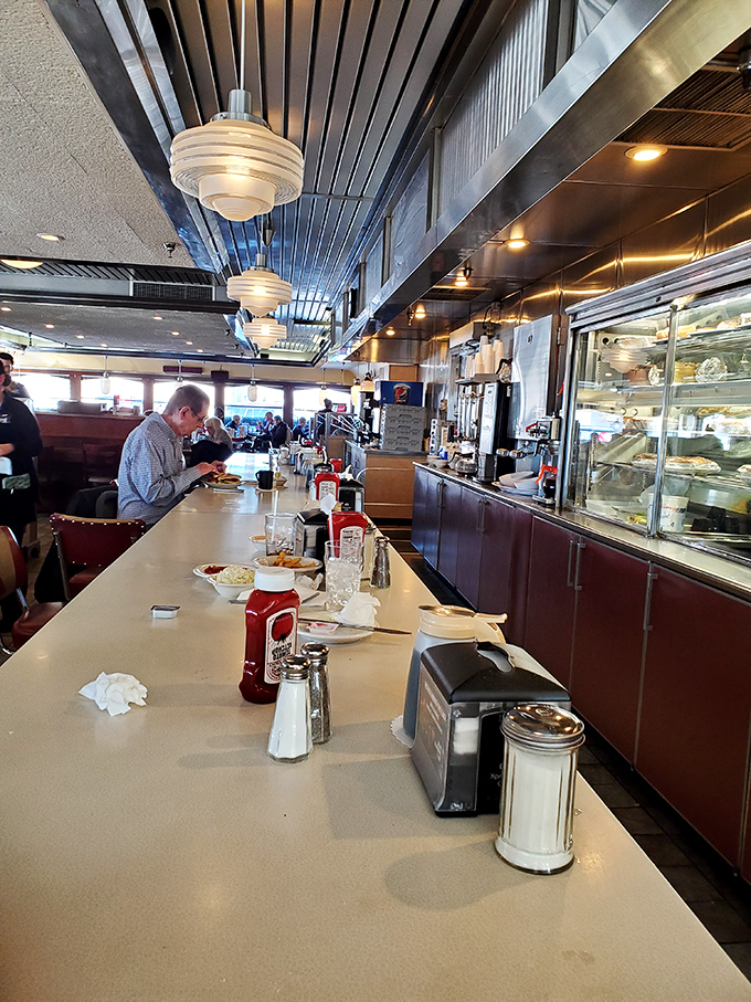 The counter seats offer front-row tickets to the greatest show in town: short-order cooks performing their breakfast ballet with practiced precision.