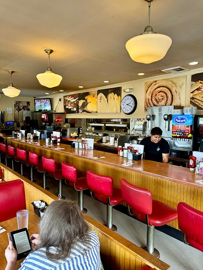 Take a seat at the counter of contentment. These red stools are front-row tickets to the greatest show on earth: breakfast in the making.