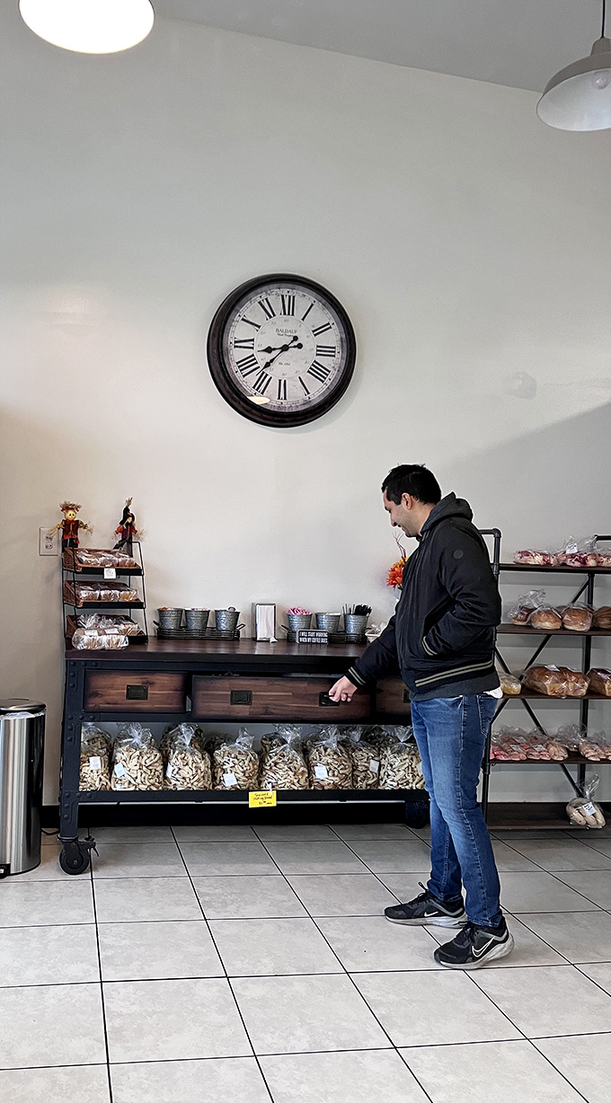 The face of pure concentration. Choosing at Beardall's is serious business – your taste buds' happiness hangs in the balance!