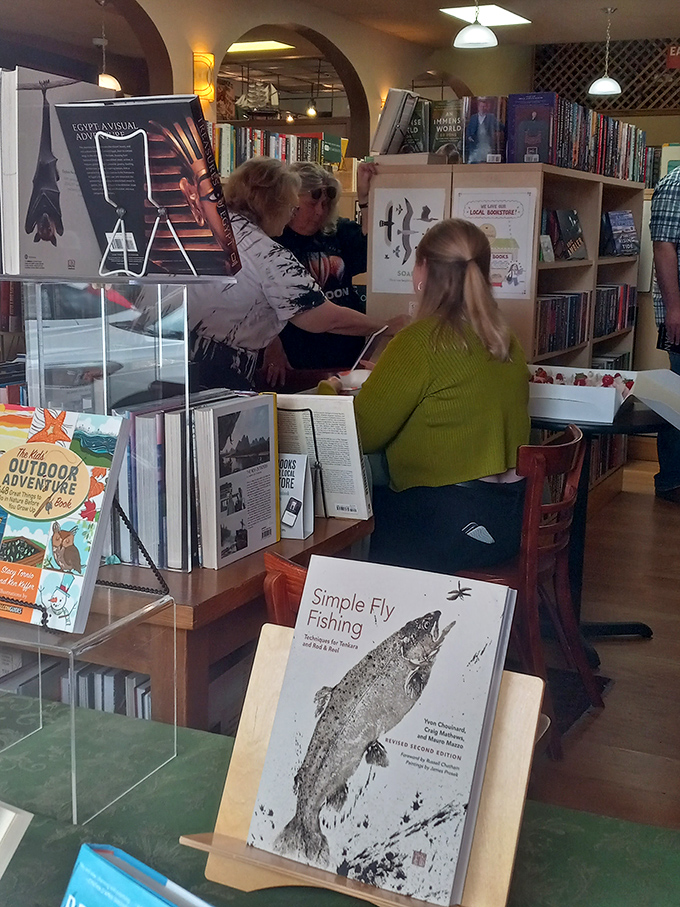 Caught in the act... of literary exploration! These customers are diving deep into Wind City's ocean of books. Happy swimming!