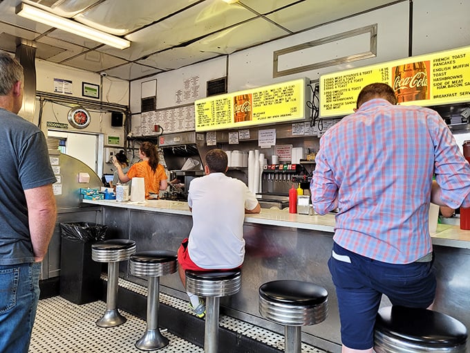Happiness served fresh! These diners know they're in for a treat &ndash; just look at those anticipatory smiles.