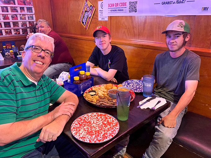 Happiness is a full plate and empty worries. These diners know they're in for a treat &ndash; just look at those smiles and that loaded table!