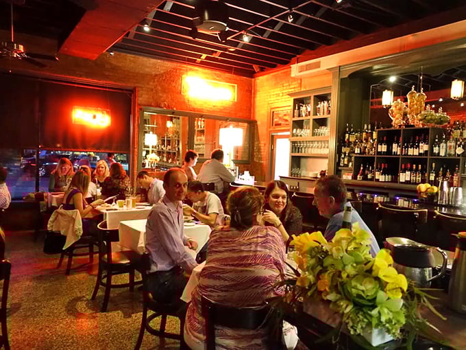 Where memories are made: diners sharing stories and spectacular food under the warm glow of Cheever's distinctive lighting.