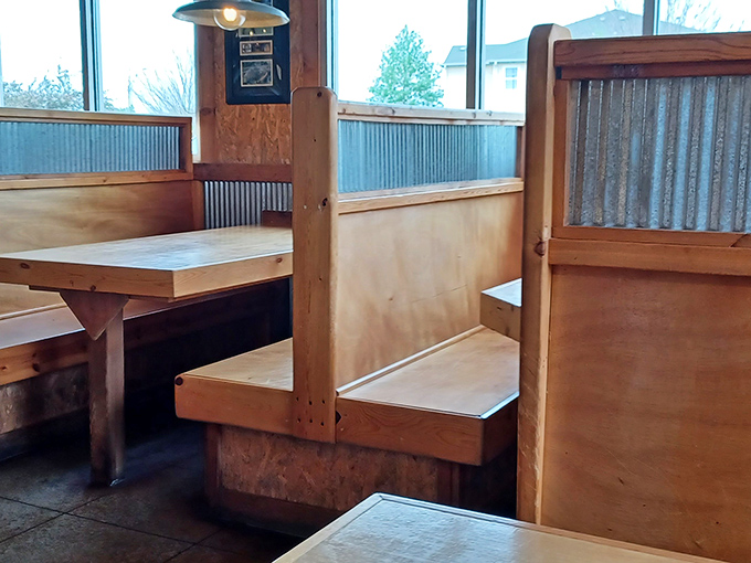 These booths aren't just seating; they're front-row tickets to the best show in town. The metal accents add industrial charm to rustic comfort.