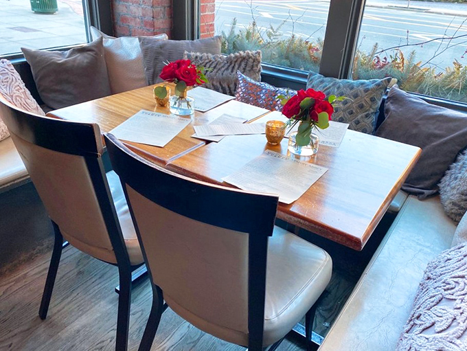 Window-side dining that transforms an ordinary meal into a special occasion. Those cushions aren't just decorative &ndash; they're encouraging you to stay awhile.