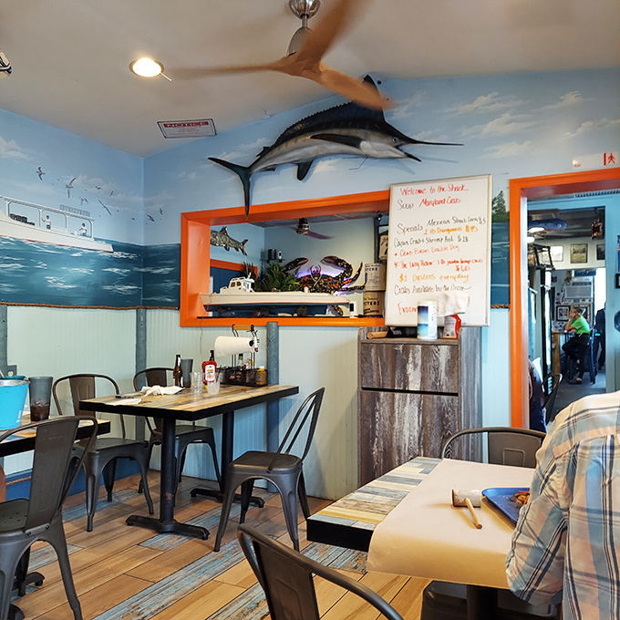 Dive into a sea of flavor! The nautical-themed dining area sets the stage for your underwater feast, minus the scuba gear.