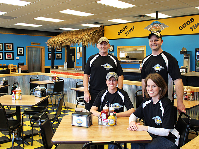 The dream team behind the smoker. These folks don't just cook BBQ; they're basically meat whisperers.